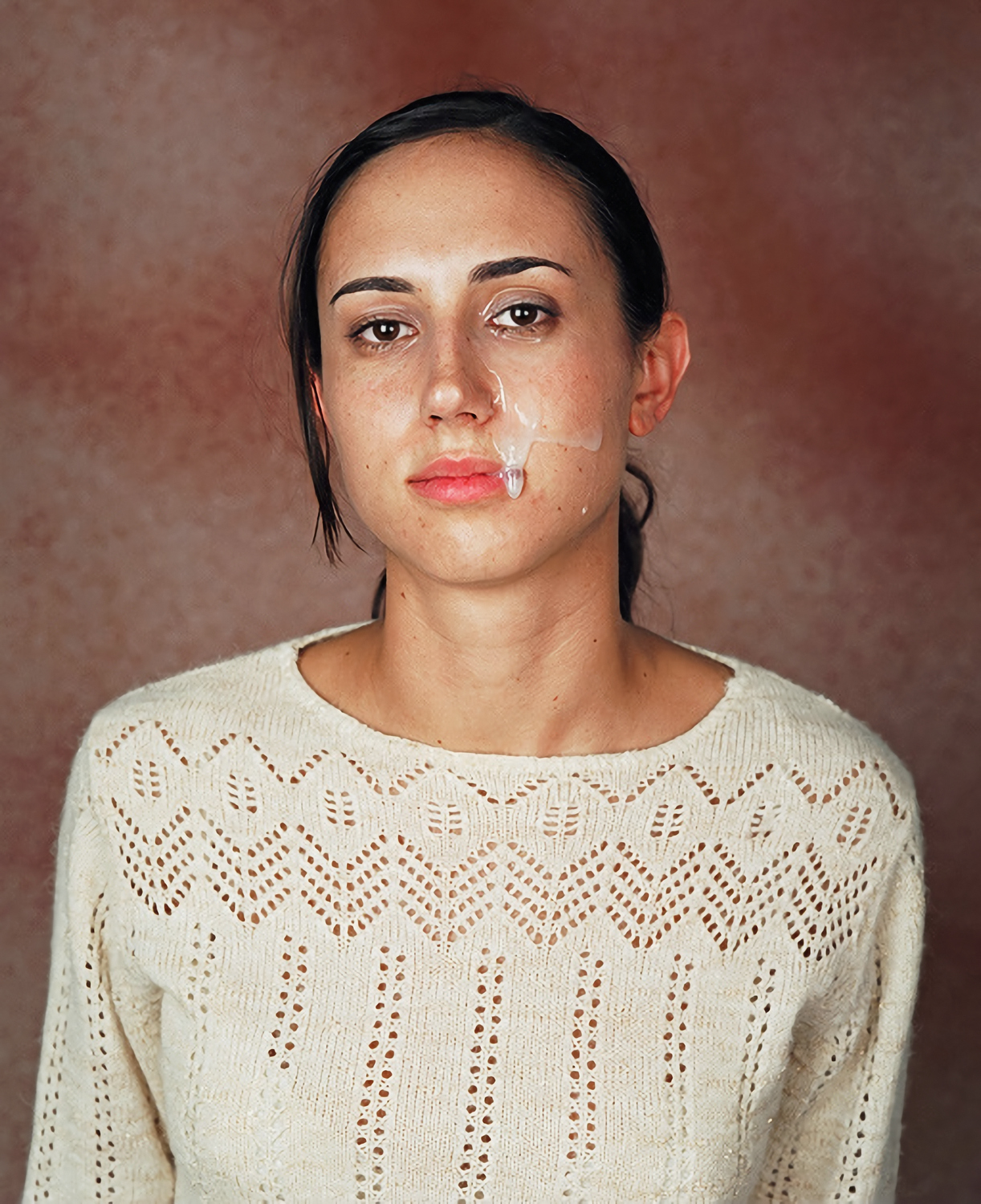 Portrait Of A Young And Very Attractive Woman Posing With Semen On Her Face For An Art Project By